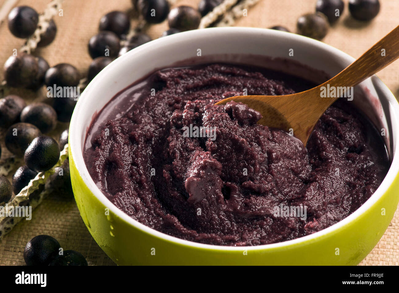 Acai fruit in the bowl and the Amazon region Stock Photo - Alamy
