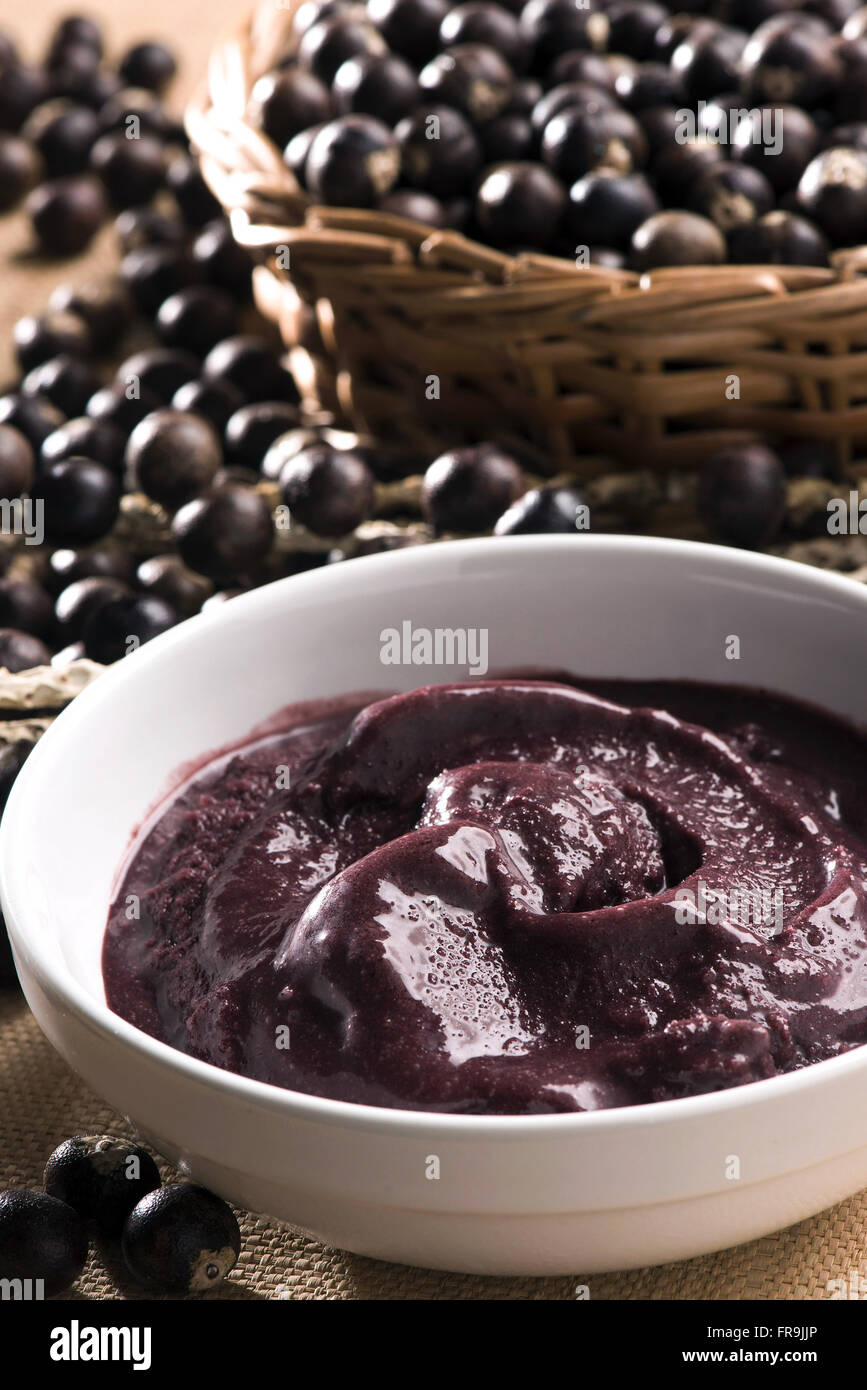 Acai fruit in the bowl and the Amazon region Stock Photo - Alamy