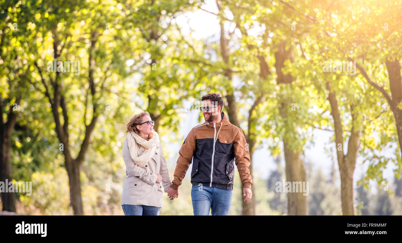 Couple in love in autumn nature on a walk Stock Photo - Alamy