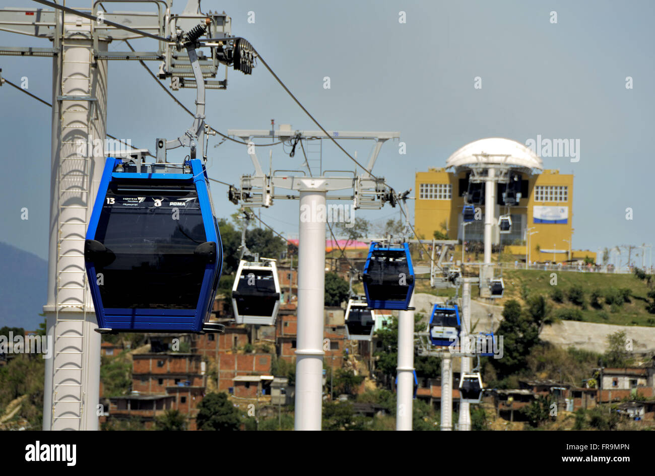 Green palm trees of Complexo do Alemao cable car - set of 13 slums in ...