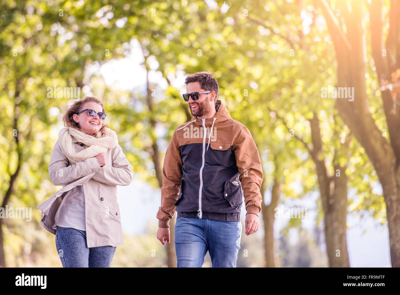 Couple in love in autumn nature on a walk Stock Photo - Alamy