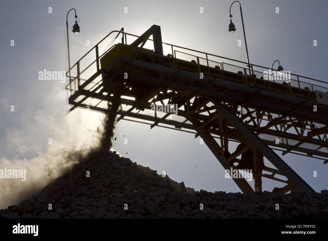 Conveyor belt to transport gravel mining grinding rocks Stock Photo - Alamy