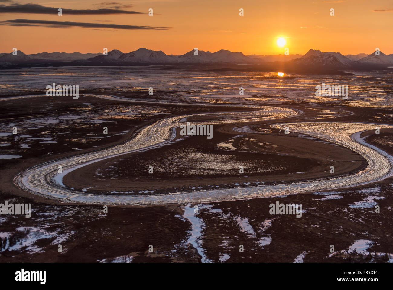 The sun sets behind the Wood River Mountains and Snake River within the ...