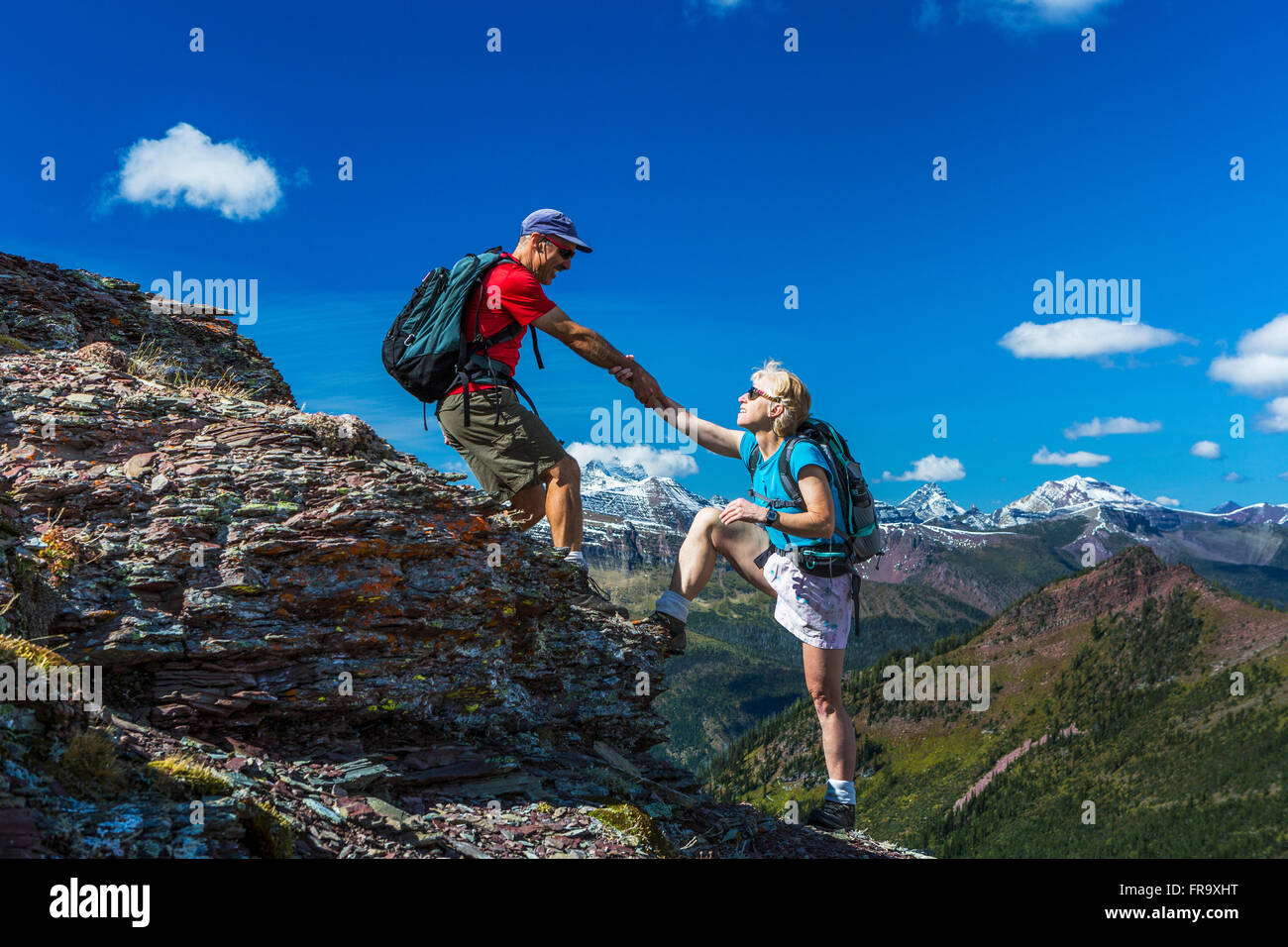 Helping hand mountain hi-res stock photography and images - Alamy