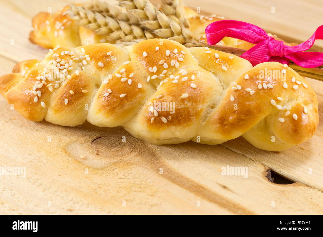 Homemade braid pastry with wheat plant and a ribbon Stock Photo - Alamy