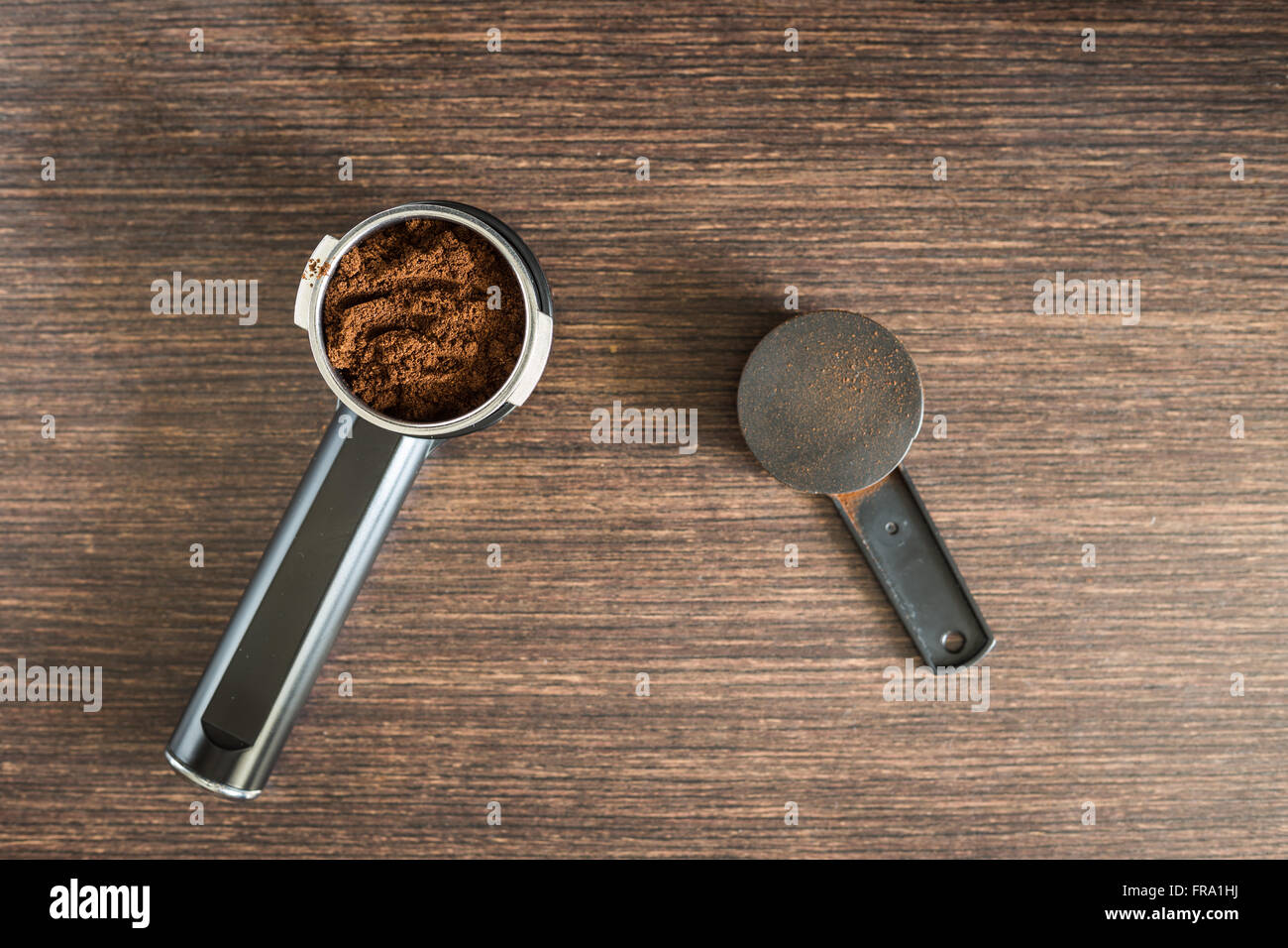 Ground coffee in brew unit on wooden counter. Top view image Stock ...