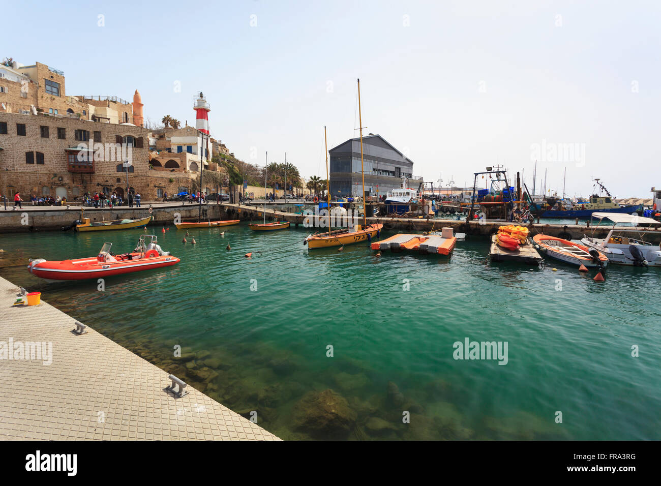 Boats in the turquoise water in the harbour; Joppa, Israel Stock Photo ...