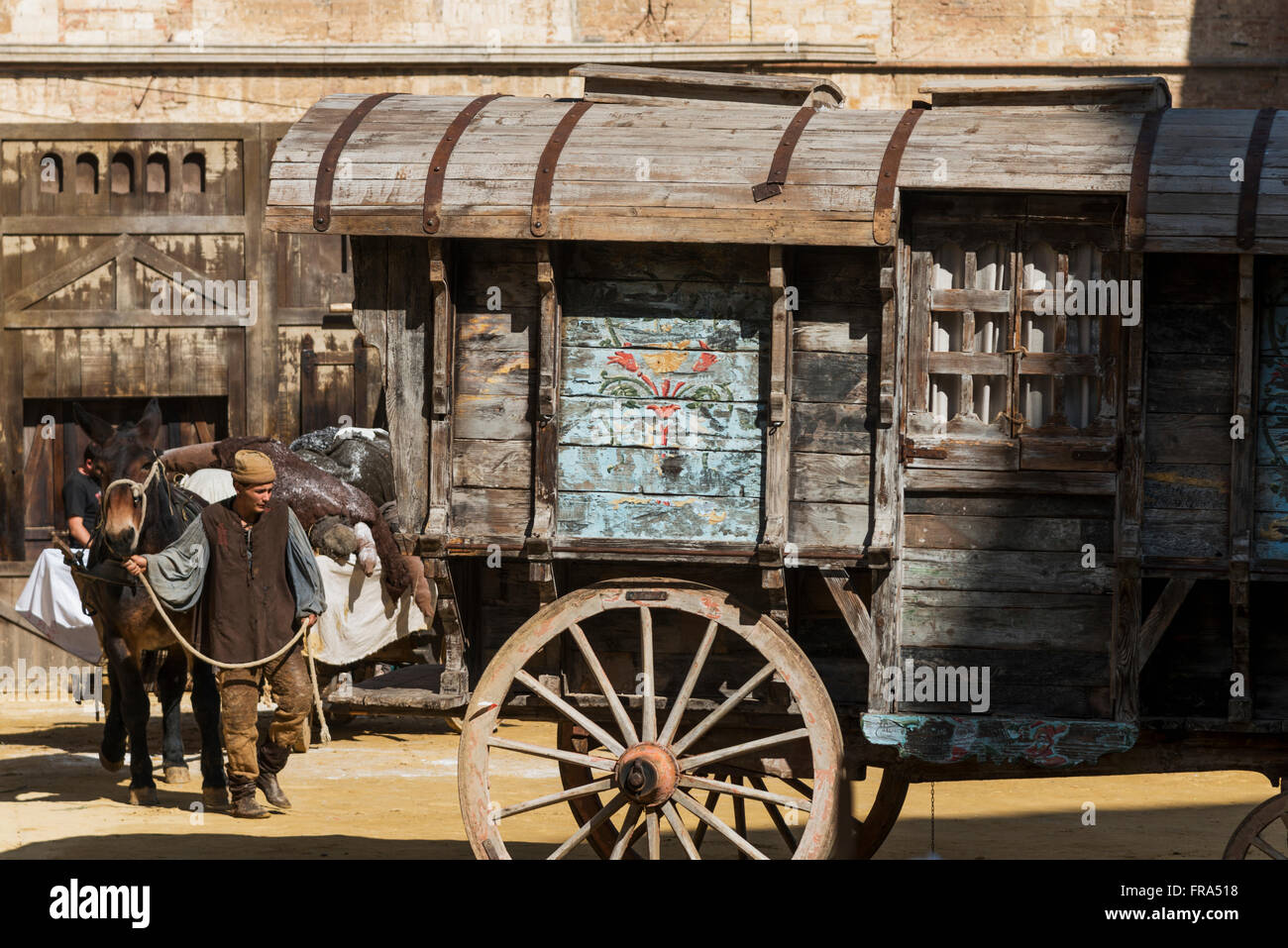 Wooden wagon in the street and a man leading a horse; Montepulciano ...