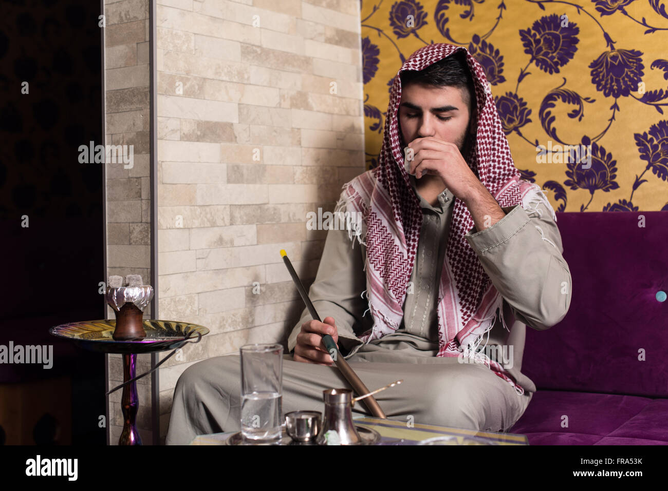 Arab man smoking shisha on hi-res stock photography and images - Alamy