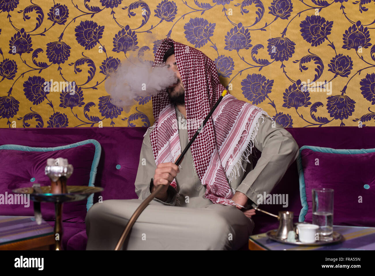 Arab man smoking shisha on hi-res stock photography and images - Alamy