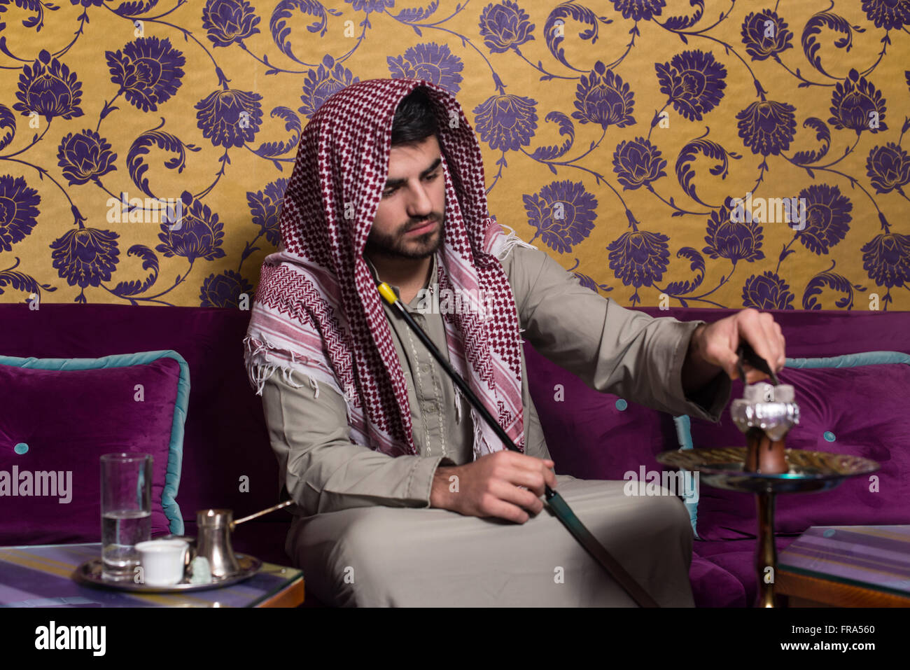 Arab man smoking shisha on hi-res stock photography and images - Alamy