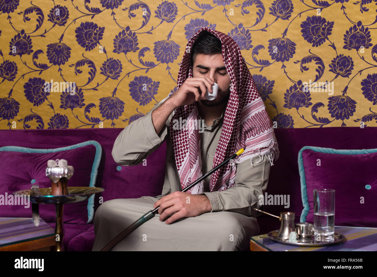 Arab man smoking shisha on hi-res stock photography and images - Alamy