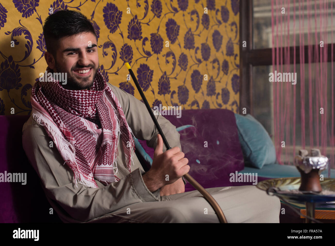 Arab man smoking shisha on hi-res stock photography and images - Alamy