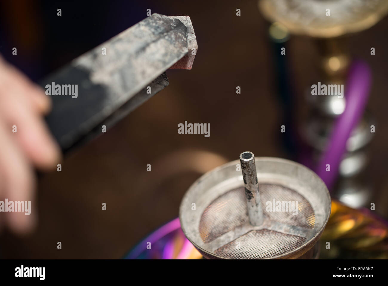 Preparation The Hookah With Charcoal For Smoking The Traditional Hubble ...