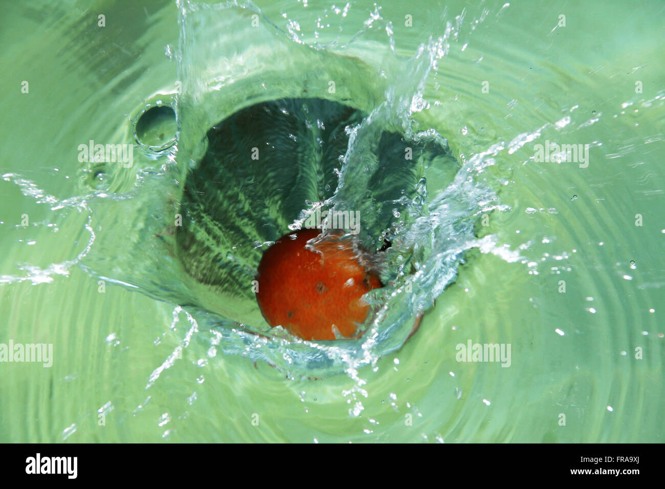 Effect of solid body breaking the surface of the water Stock Photo - Alamy