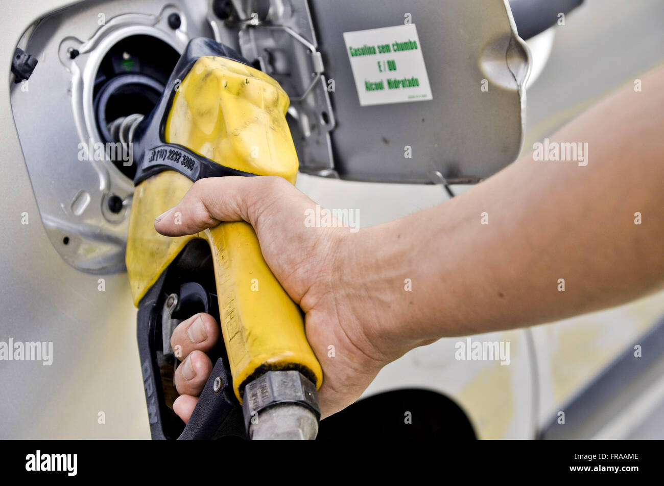 Automobile fueling station attendant Stock Photo - Alamy