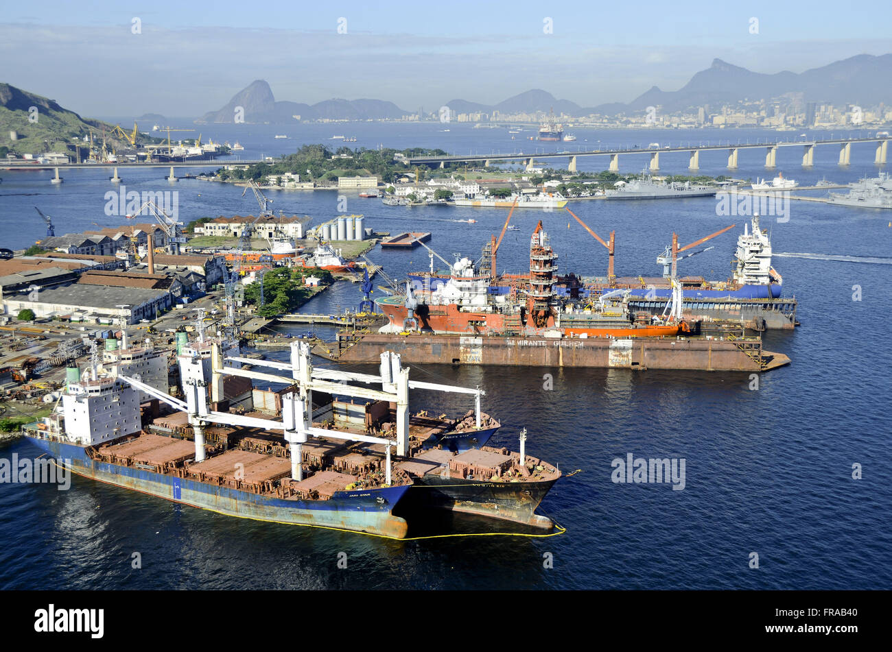 Aerial view of merchant ship docked for repairs in a shipyard ...