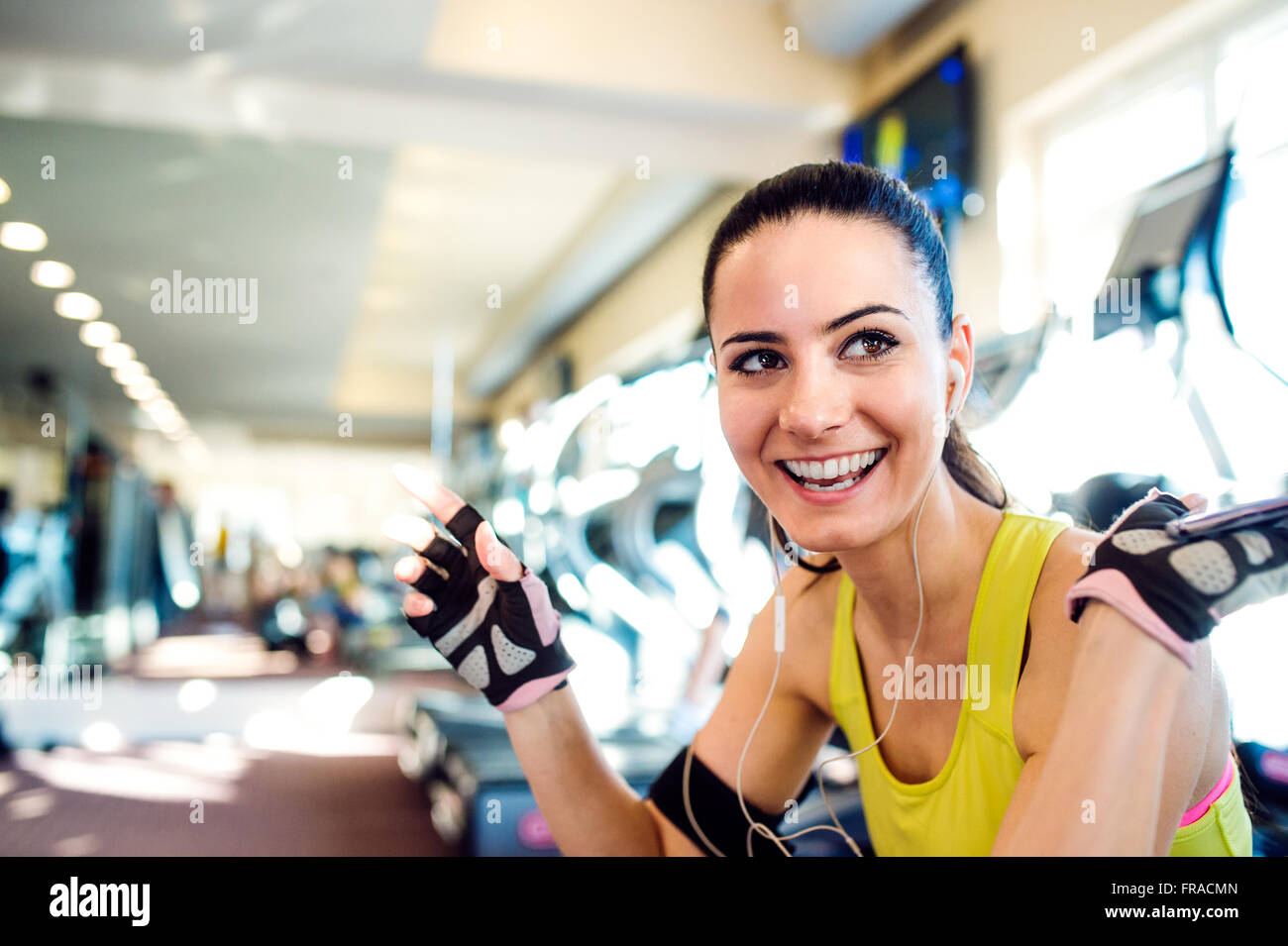 Attractive fit woman in a gym taking a break Stock Photo - Alamy