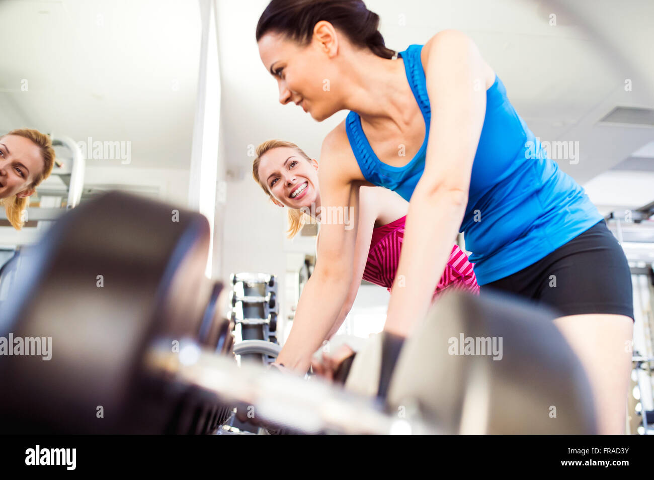Detail of women in gym working out with weights Stock Photo - Alamy