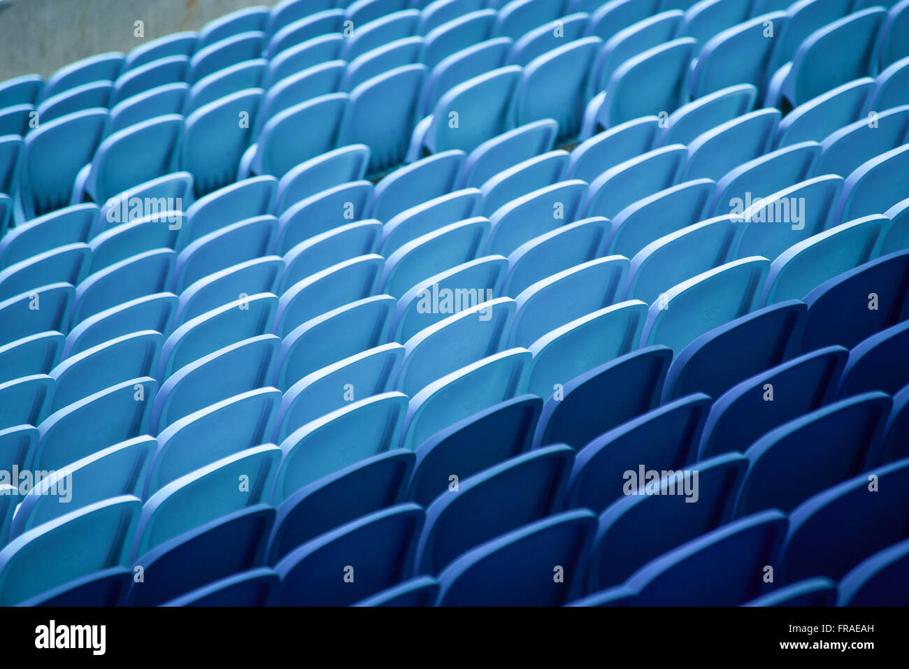 Detail of blue chairs in the football stadium bleachers Stock Photo - Alamy