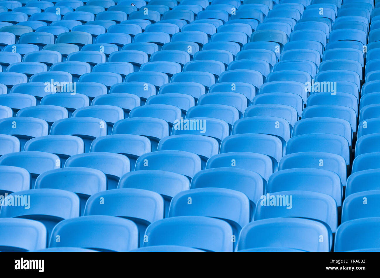 Detail of blue chairs in the football stadium bleachers Stock Photo - Alamy