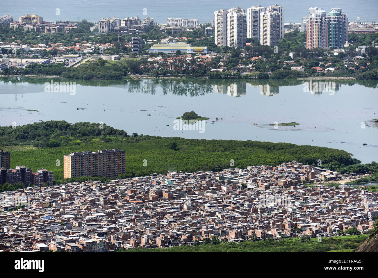 Aerial view of the Rio das Pedras favela with Lagoa da Tijuca and ...