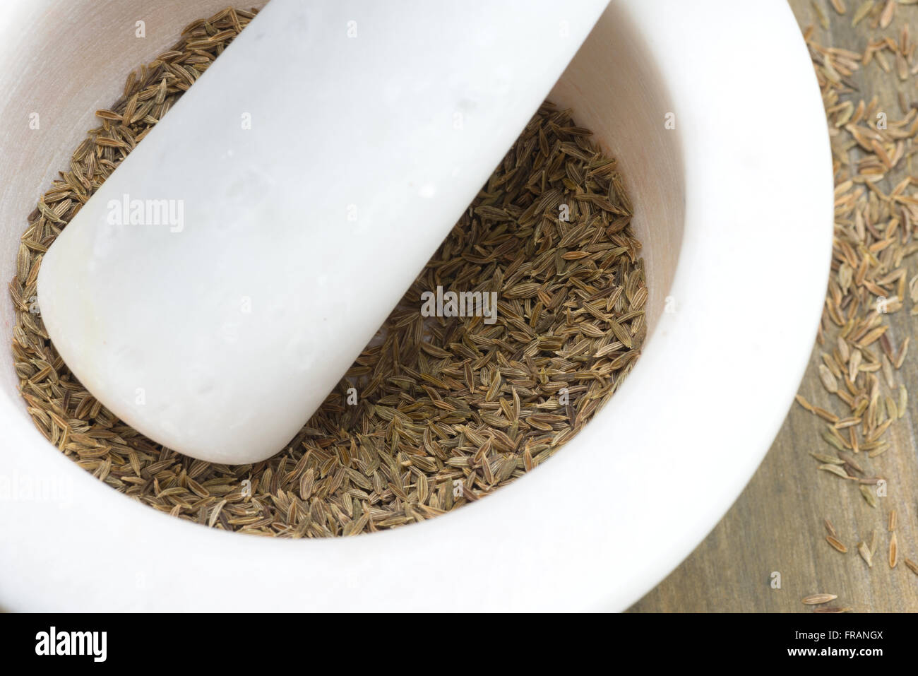 Zira or cumin - seeds in a marble mortar for spices Stock Photo - Alamy