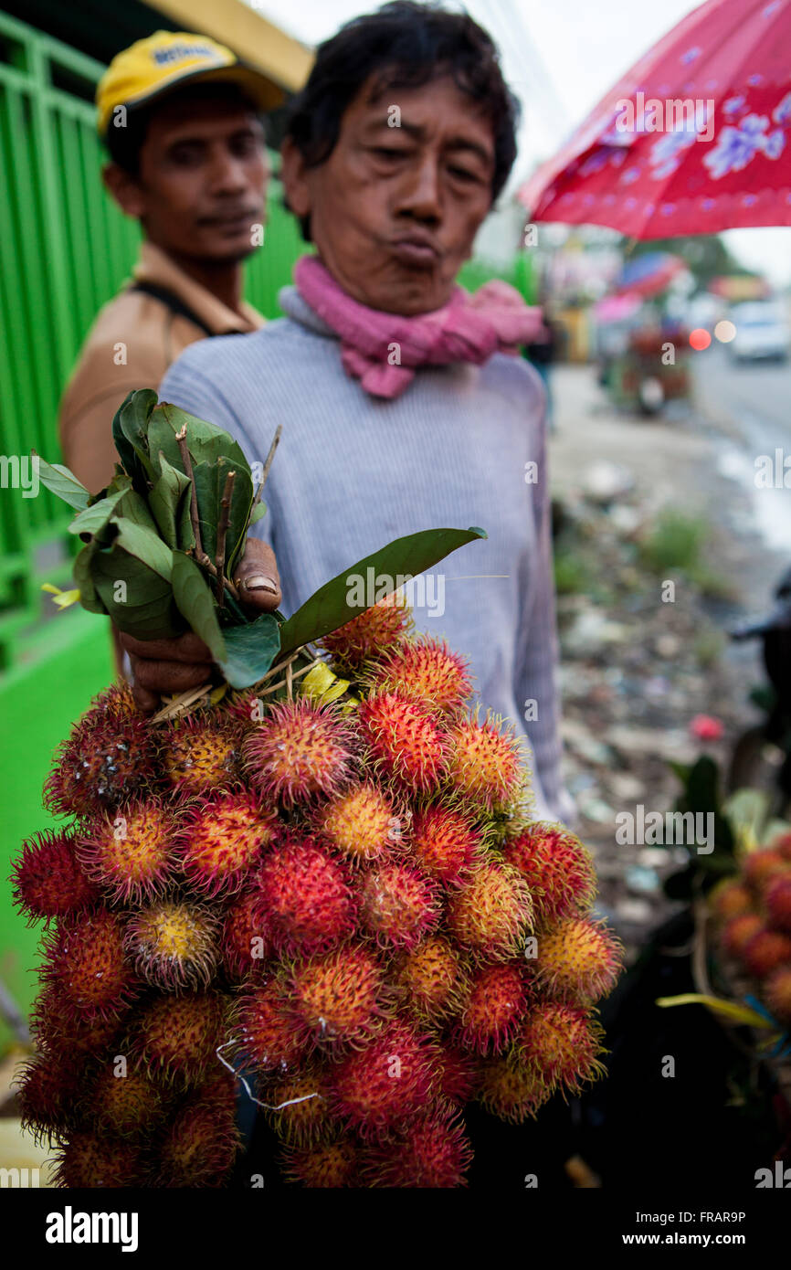 Rambutan being sold at the road side, Indonesia Stock Photo - Alamy