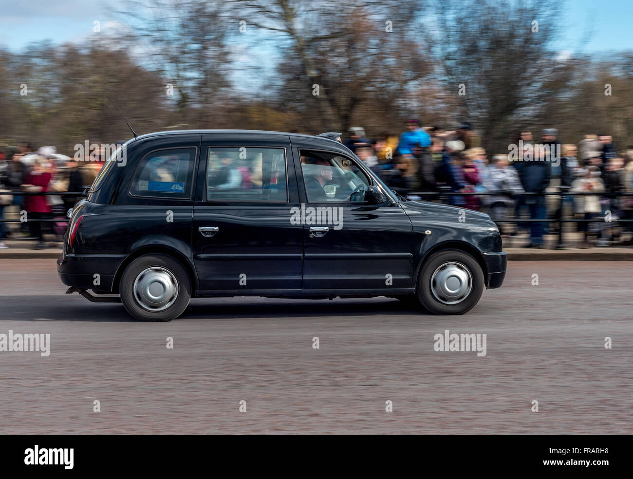 A moving taxi cab speeding through the streets of London Stock Photo ...