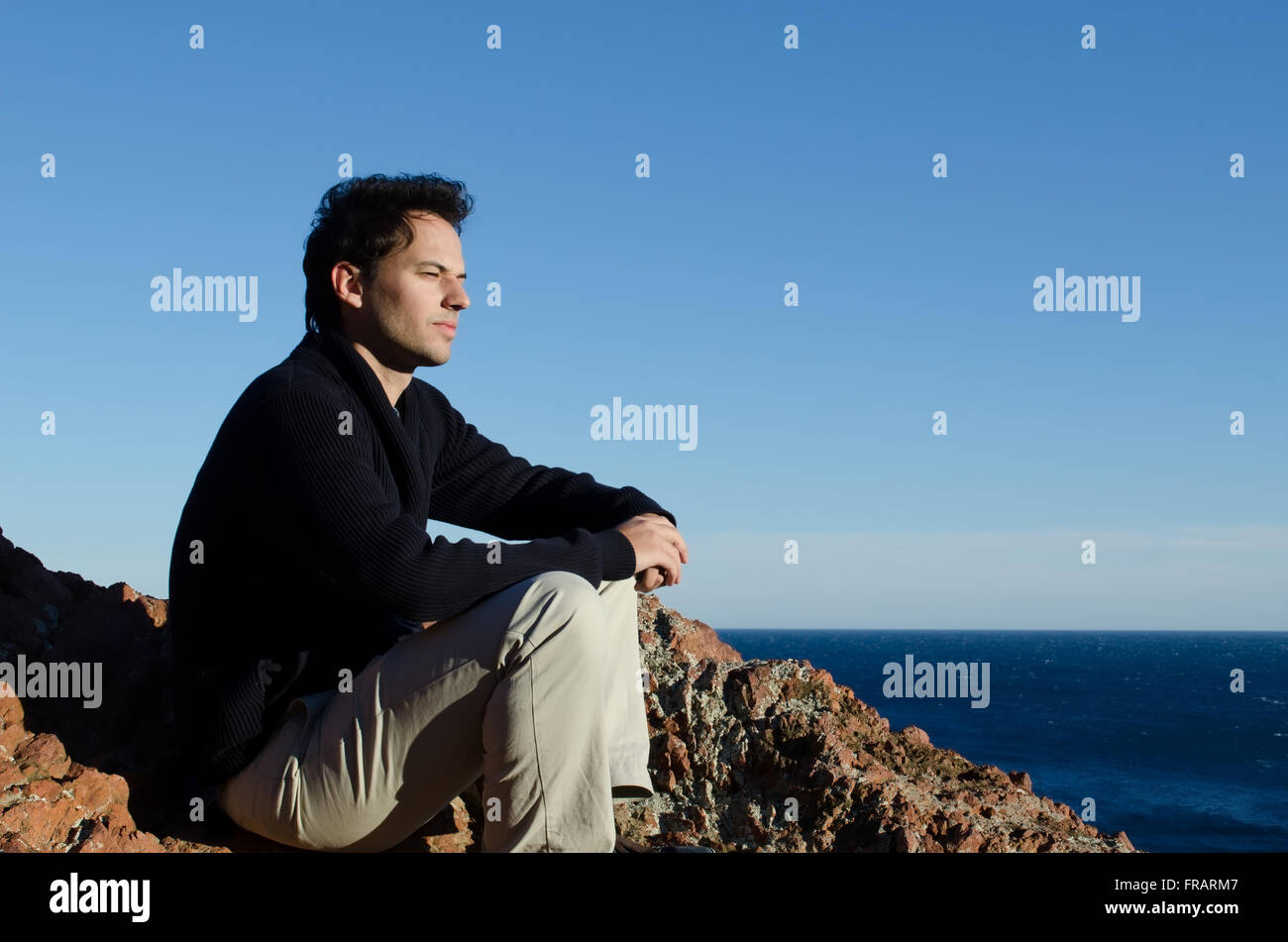A man thinking and looking at the horizon Stock Photo - Alamy