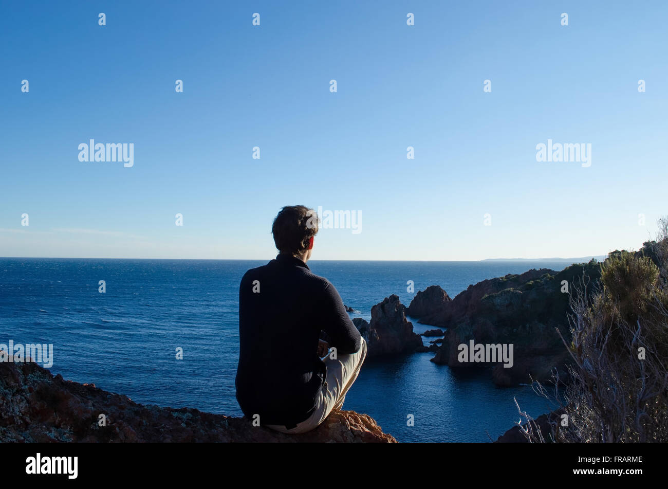 A man thinking and looking at the horizon Stock Photo - Alamy