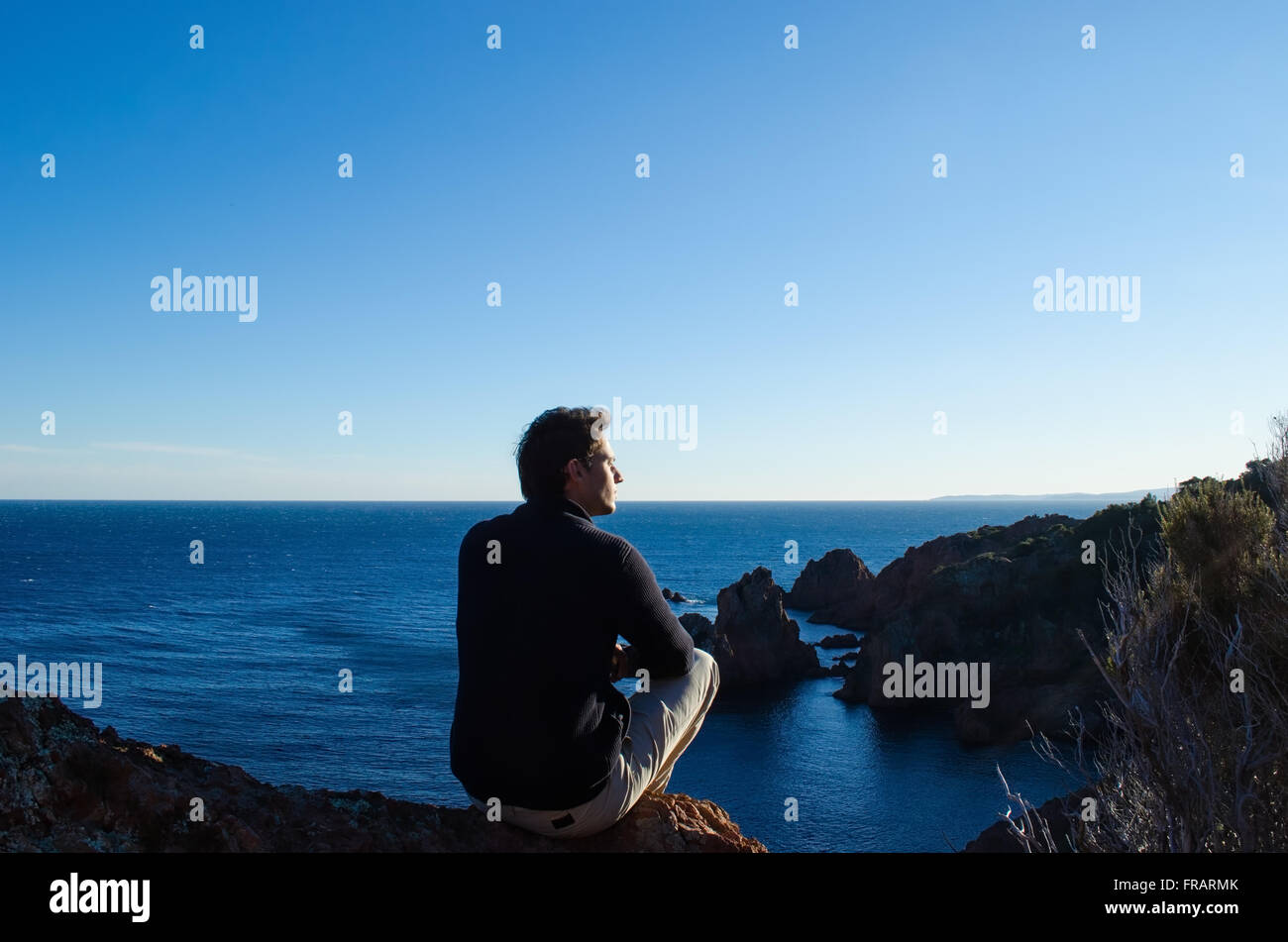 A man thinking and looking at the horizon Stock Photo - Alamy