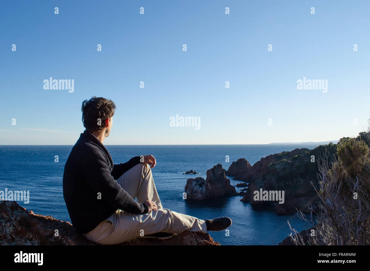A man thinking and looking at the horizon Stock Photo - Alamy