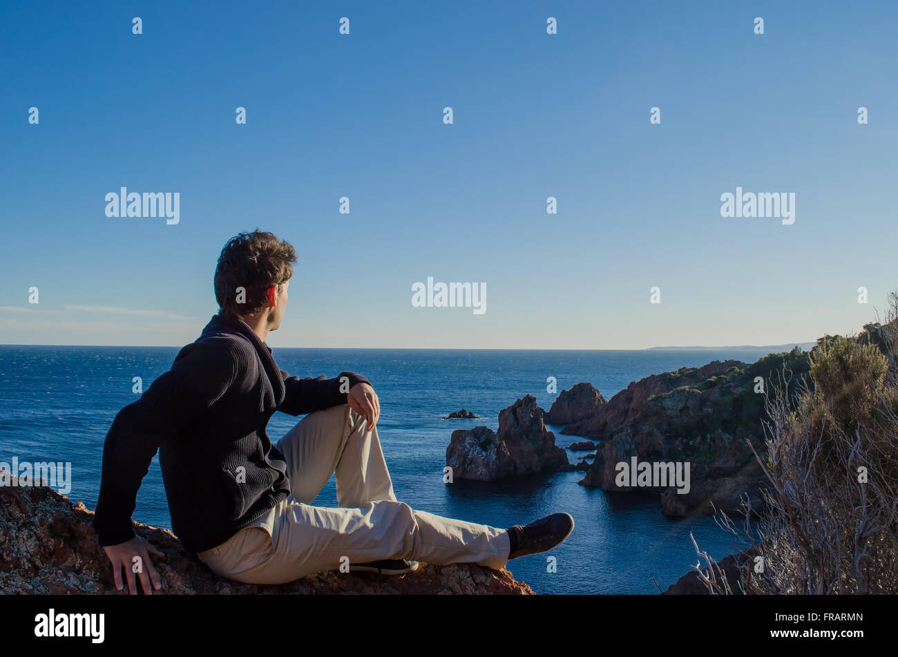 A man thinking and looking at the horizon Stock Photo - Alamy