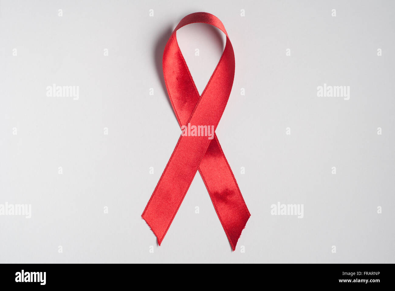 AIDS red ribbon on a white background isolated Stock Photo - Alamy