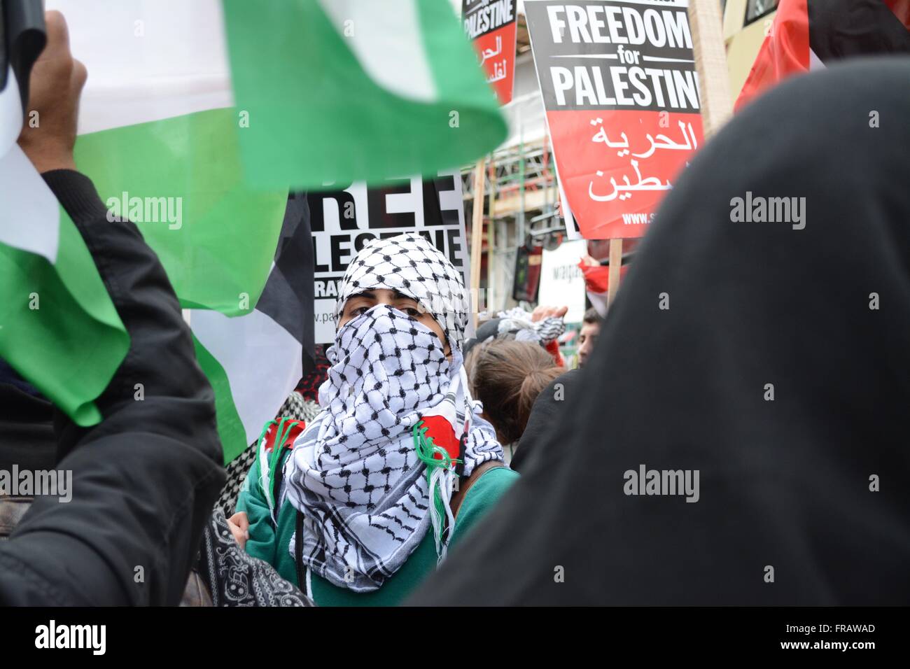 October 17th 2015. London, England. Female protester wearing a face ...