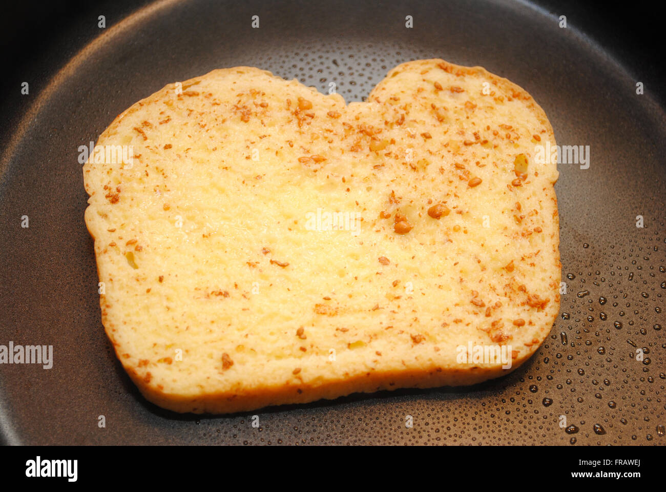 Uncooked Cinnamon French Toast in a Fry Pan Stock Photo - Alamy