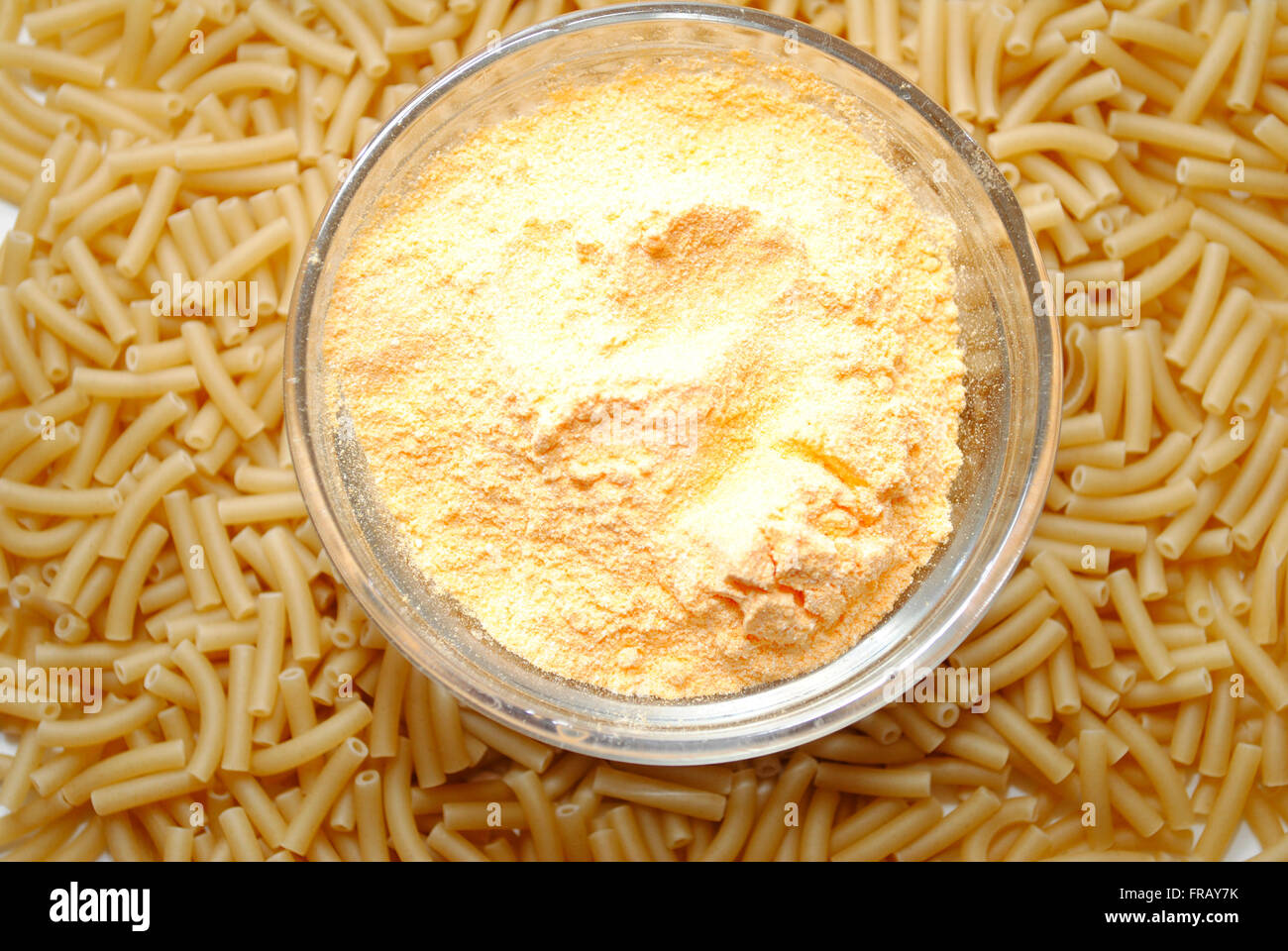 A Bowl with Powdered Cheese on Uncooked Pasta Stock Photo - Alamy