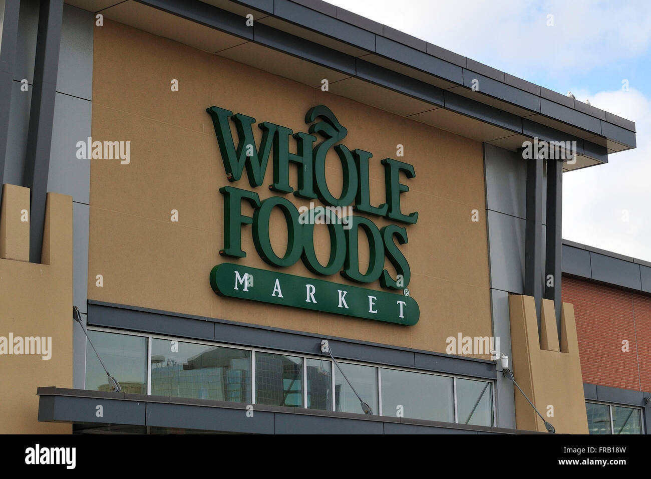 Signage with the WHOLE FOODS Market logo is displayed outside Whole ...