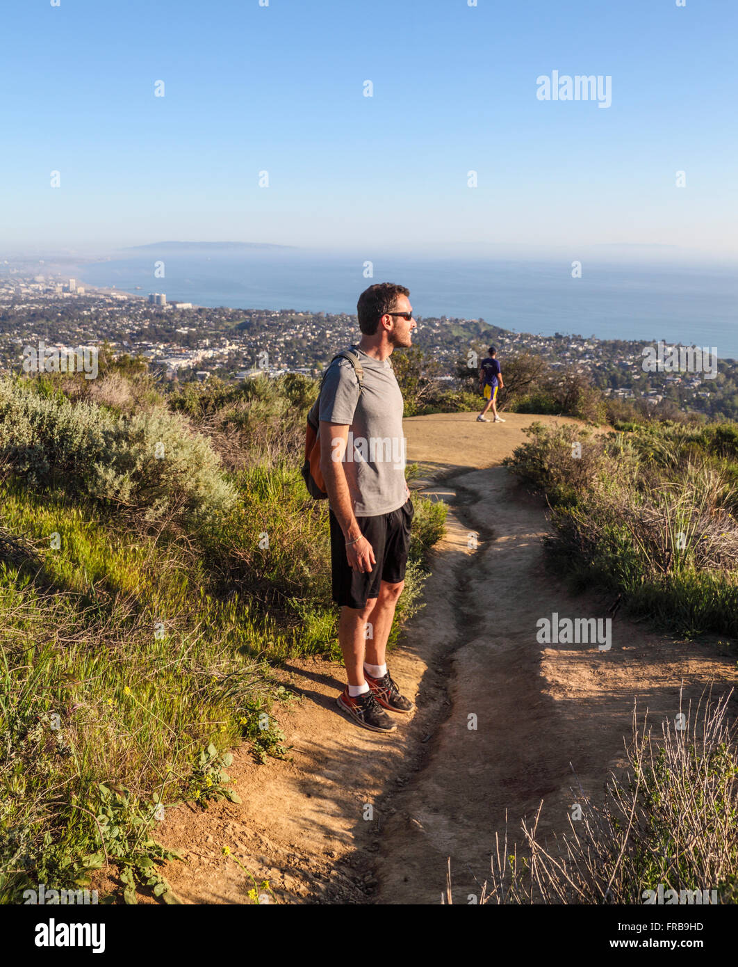 Hikers on the Temescal Ridge Trail see ocean Stock Photo - Alamy