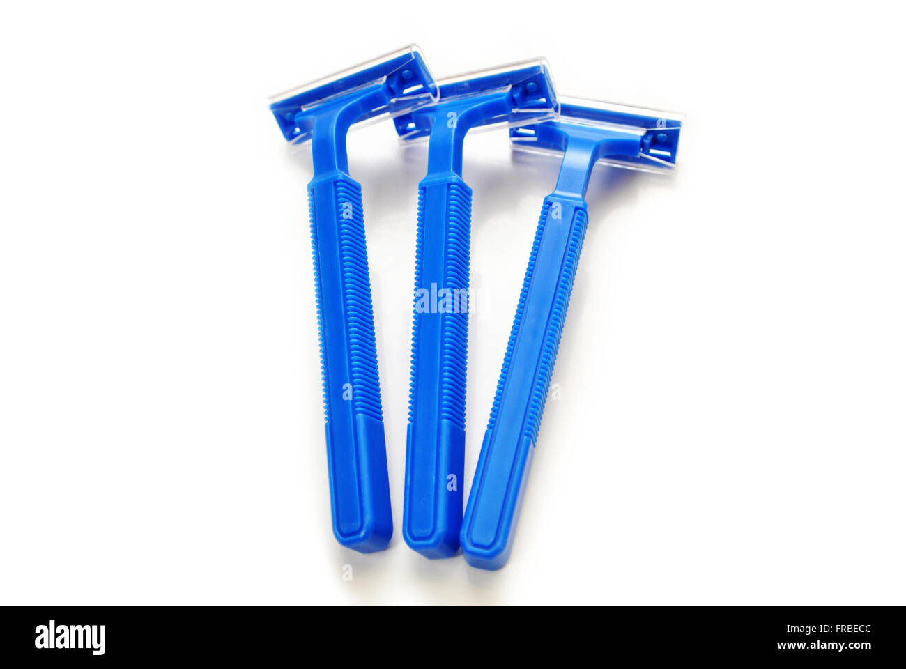 Three Blue Disposable Razors Isolated Over White Stock Photo - Alamy