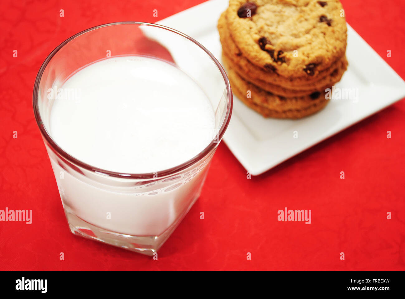 Glass of Cold Milk with Cookies in the Background Stock Photo - Alamy