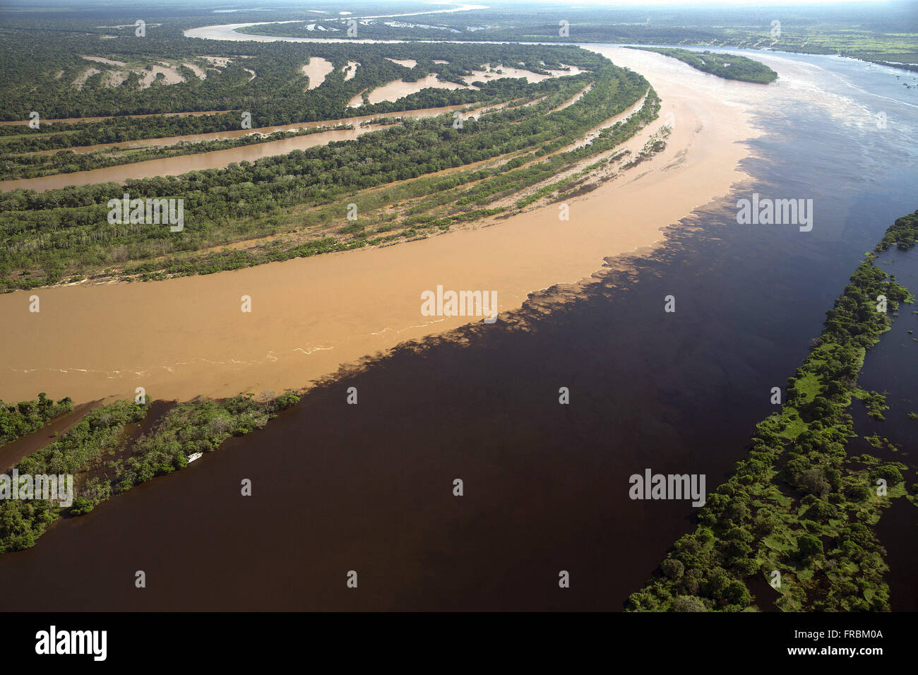 Aerial view of Rio Guapore meeting between dark and clean waters with ...