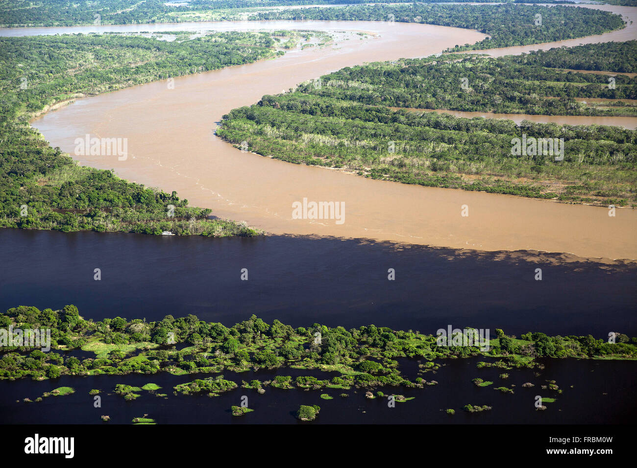 Aerial view of Rio Guapore meeting between dark and clean waters with ...