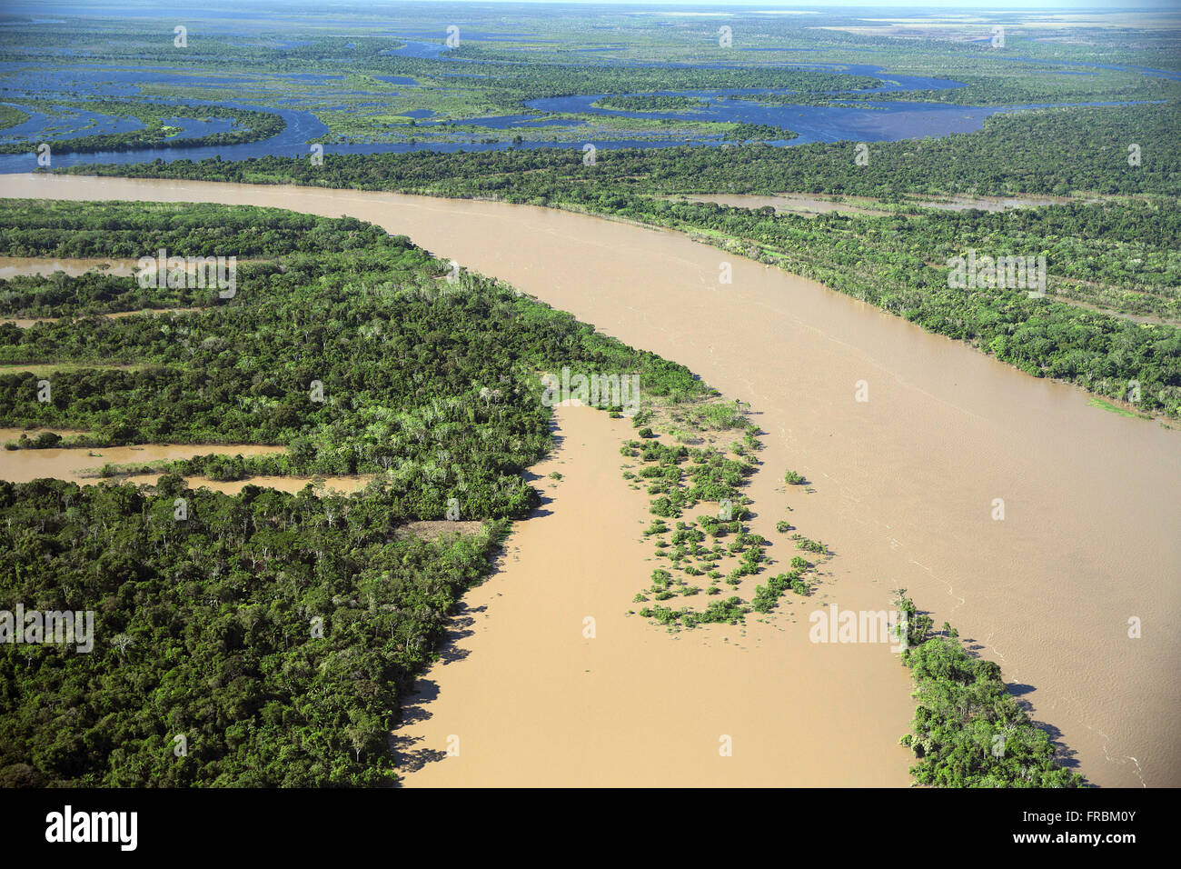 Aerial view of Rio Guapore meeting between dark and clean waters with ...