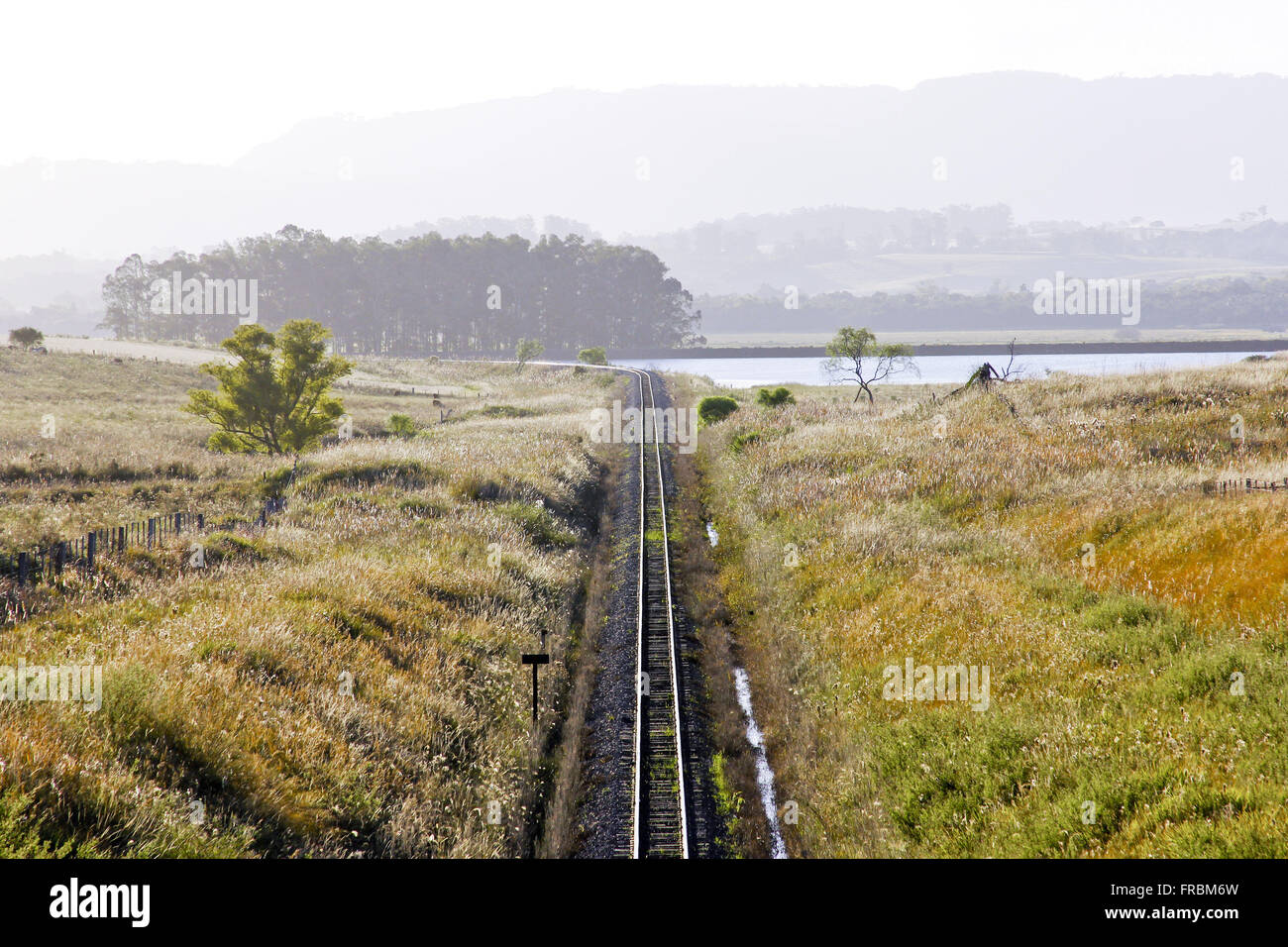 Bucolic landscape at dusk with the bottom rail, and dam Stock Photo - Alamy