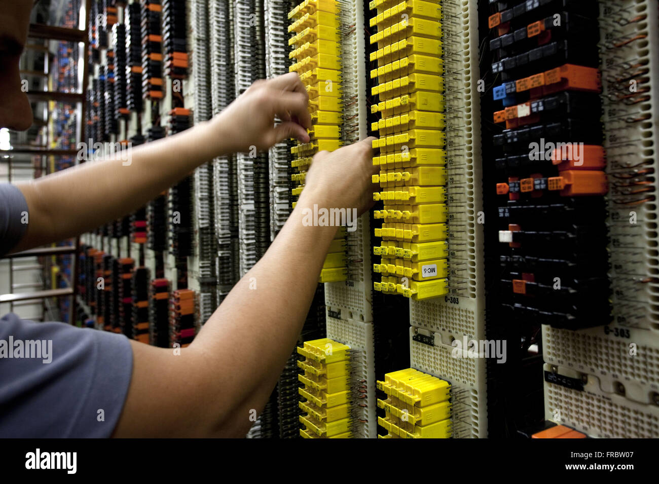Worker in the room in general distributor of telecom operator Stock ...