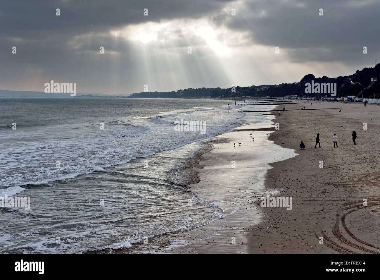 Bournemouth beach with sunburst through clouds Stock Photo - Alamy