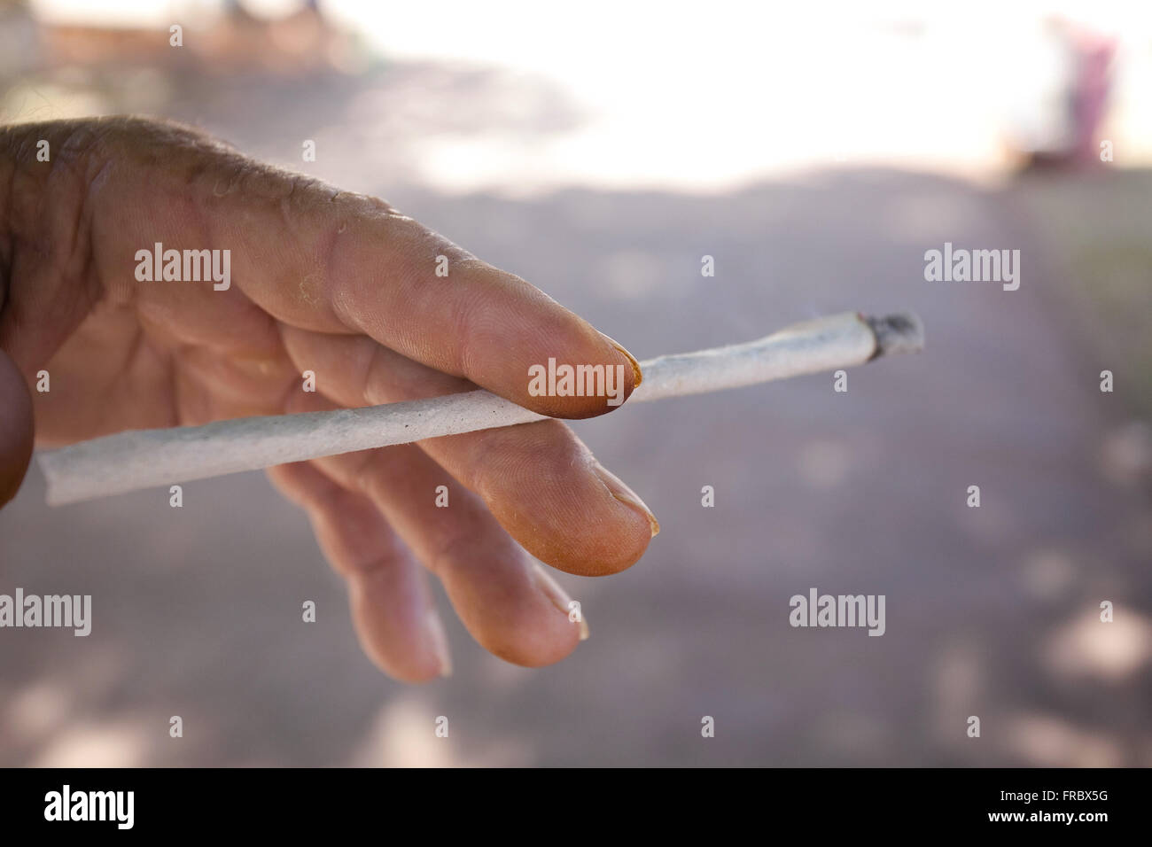 Elderly crafted cigarette smoking Stock Photo - Alamy
