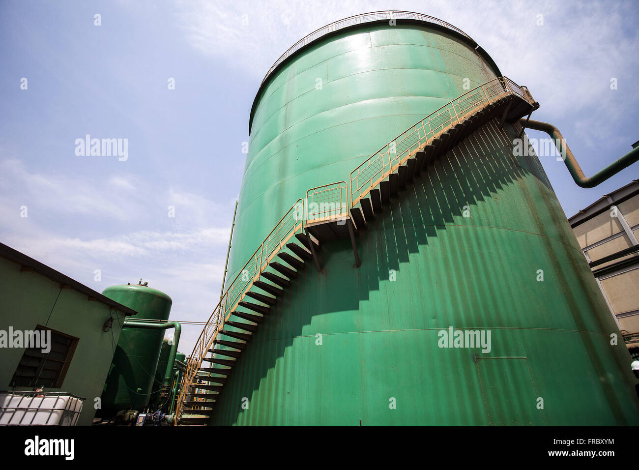 Alcohol plant tank and sugar in the countryside Stock Photo - Alamy
